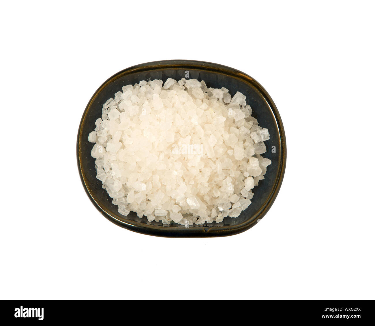 Coarse salt in a bowl isolated on a white background. View from above ...