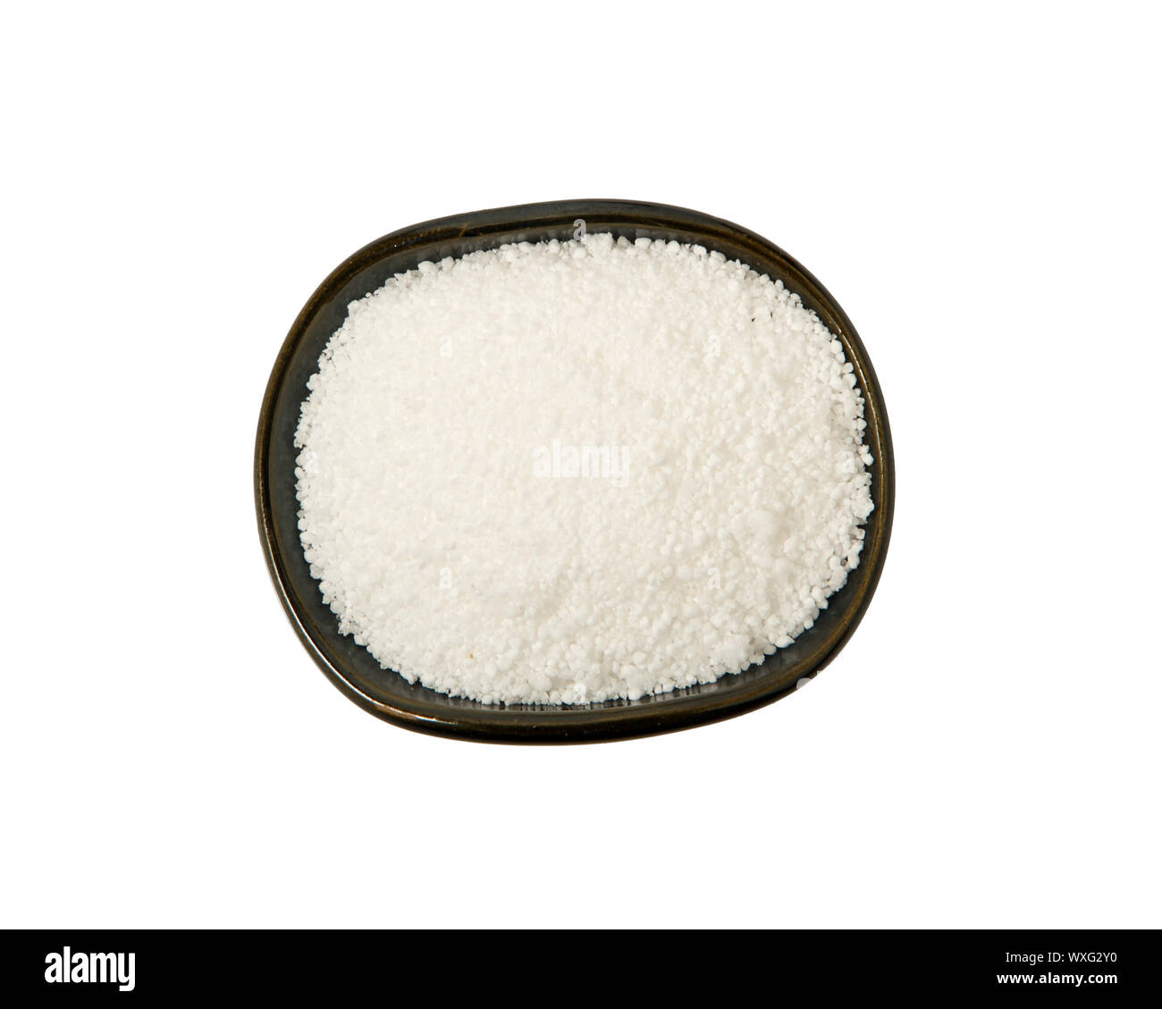 Citric acid in a bowl isolated on a white background. View from above ...