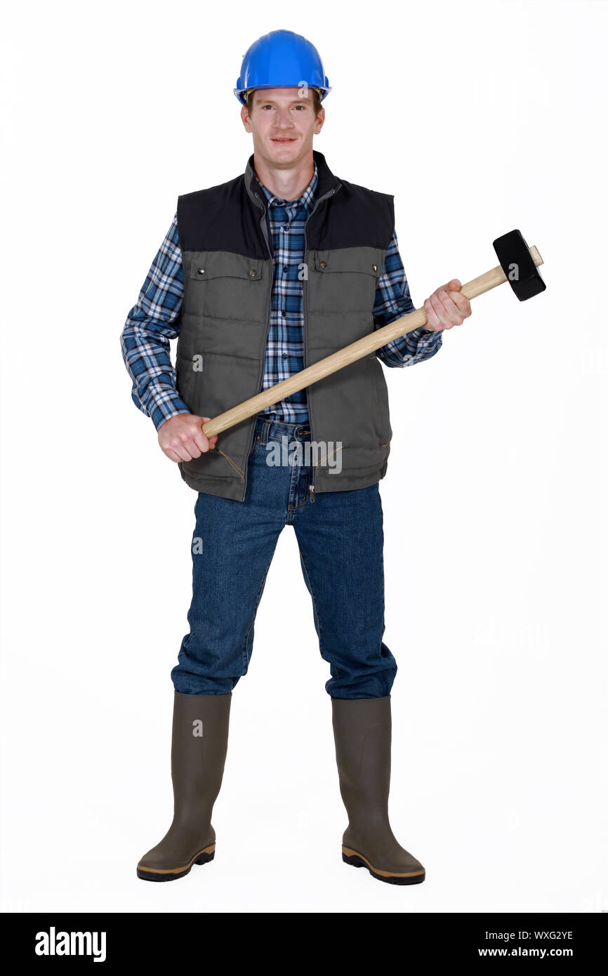 Man with sledge hammer ready to work Stock Photo - Alamy