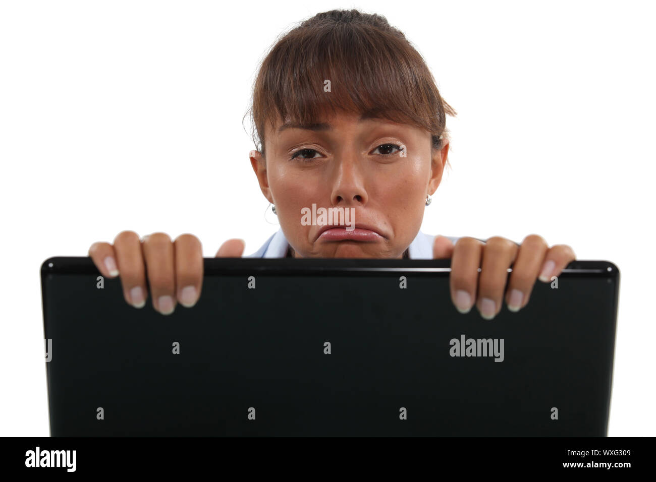 Sad woman with a laptop computer Stock Photo - Alamy