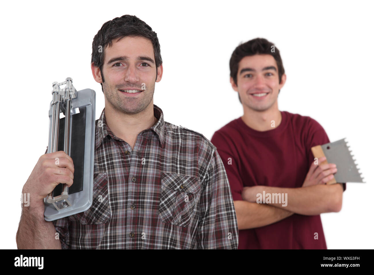 Team tile fitters holding tools hi-res stock photography and images - Alamy