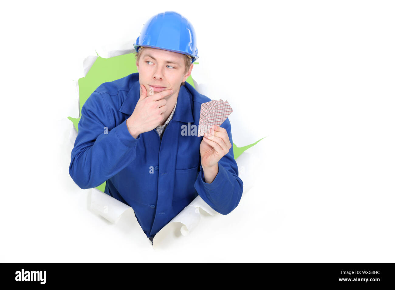 Worker with playing cards Stock Photo - Alamy