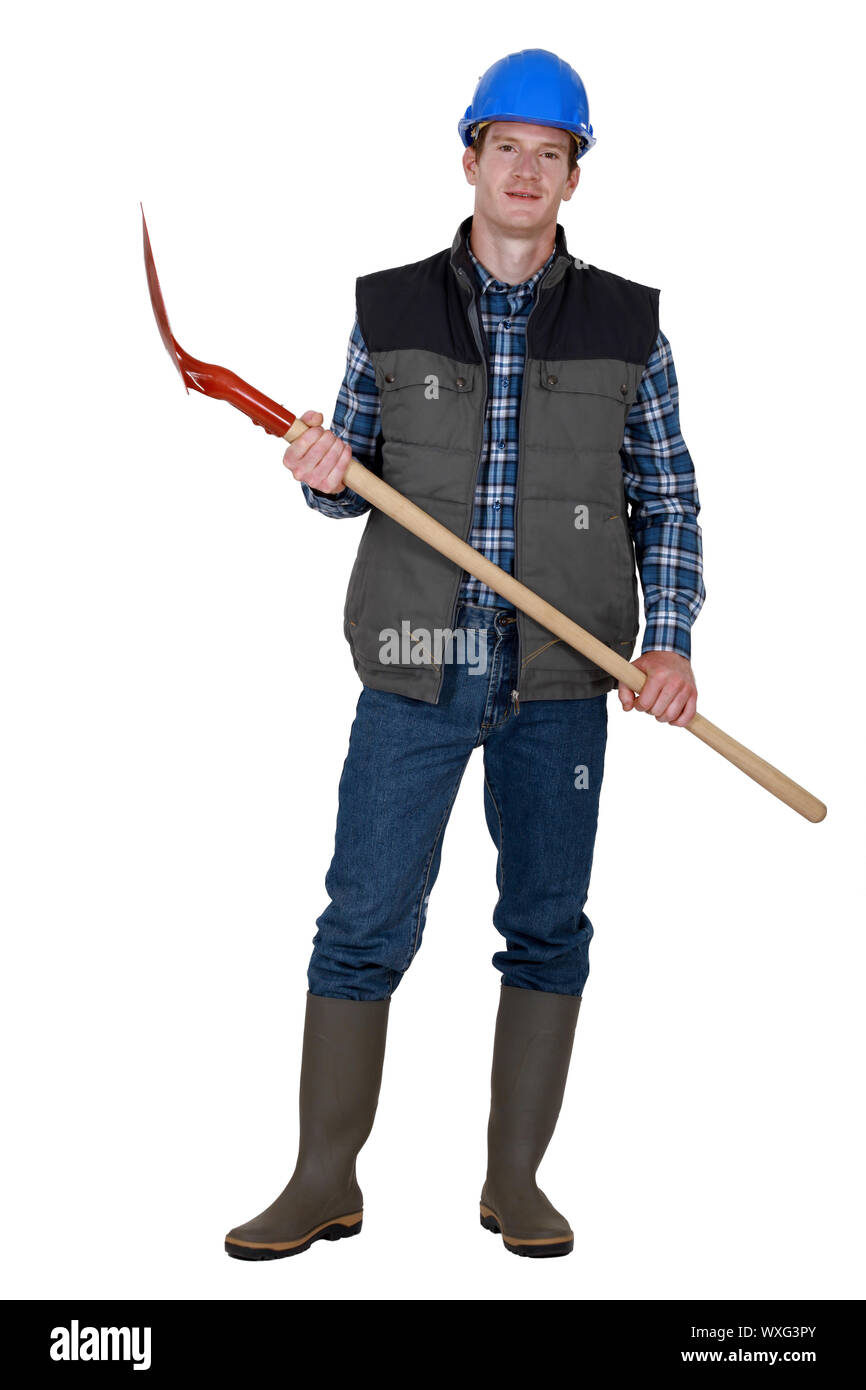Labourer holding spade hi-res stock photography and images - Alamy