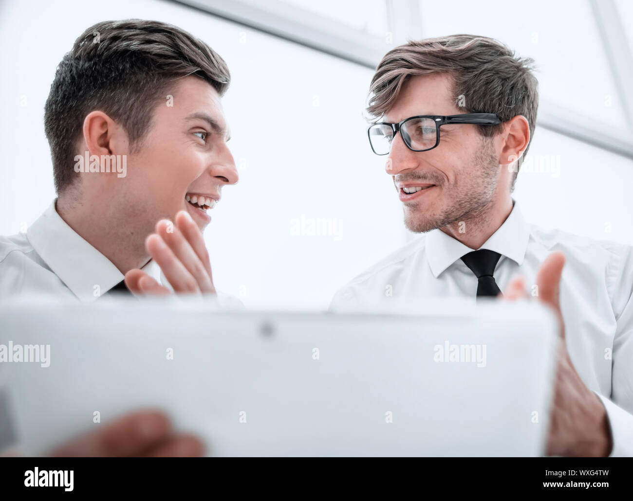 close up.young employees use a digital tablet Stock Photo - Alamy