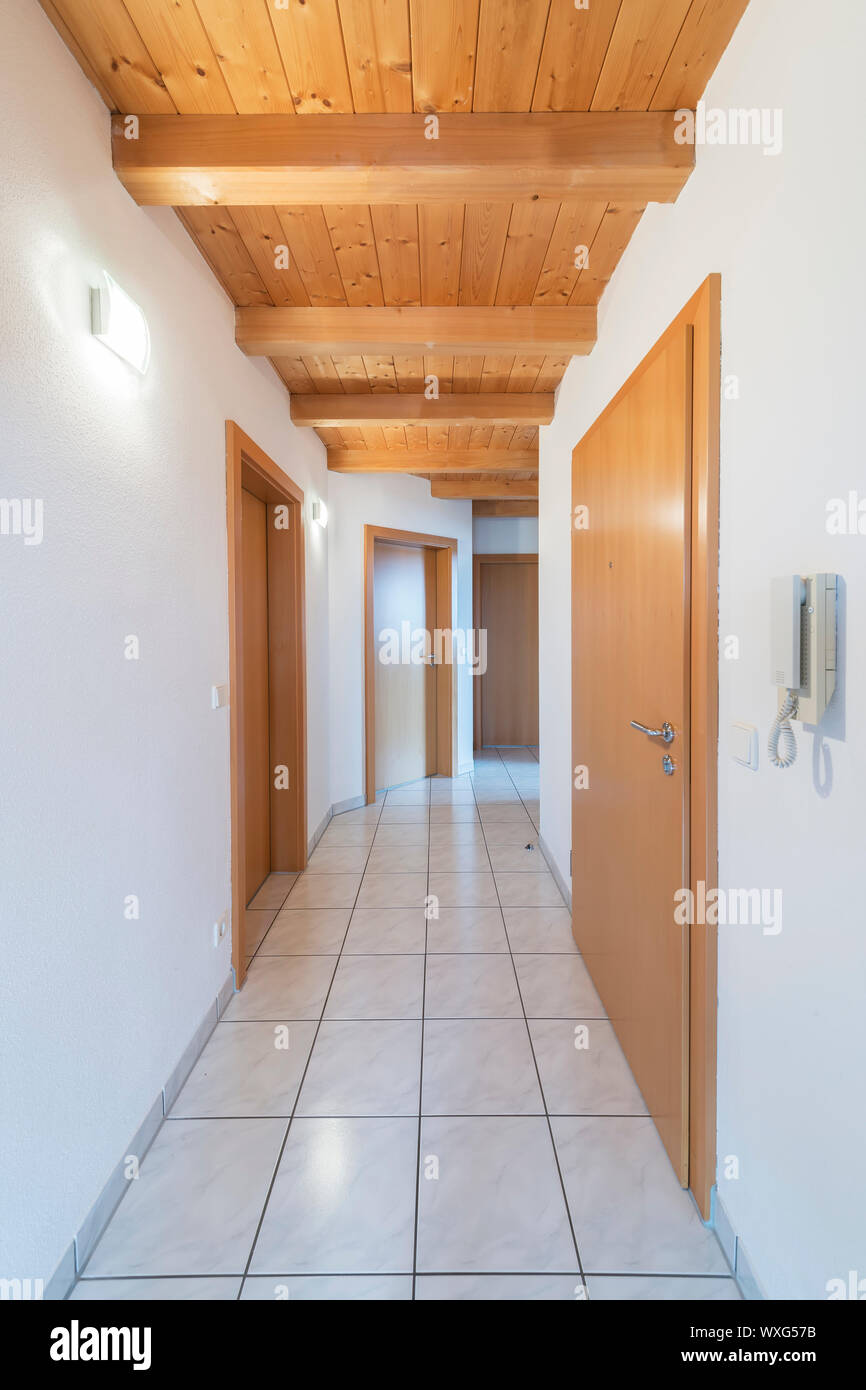 White tiled corridor in an appartment Stock Photo - Alamy