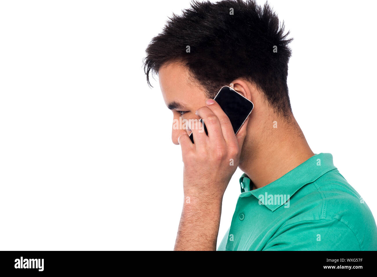 Side pose of a handsome boy communicating Stock Photo - Alamy