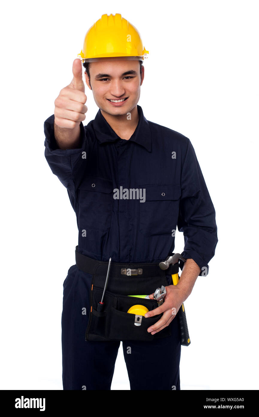 Handsome man in yellow safety helmet and construction worker uniform ...