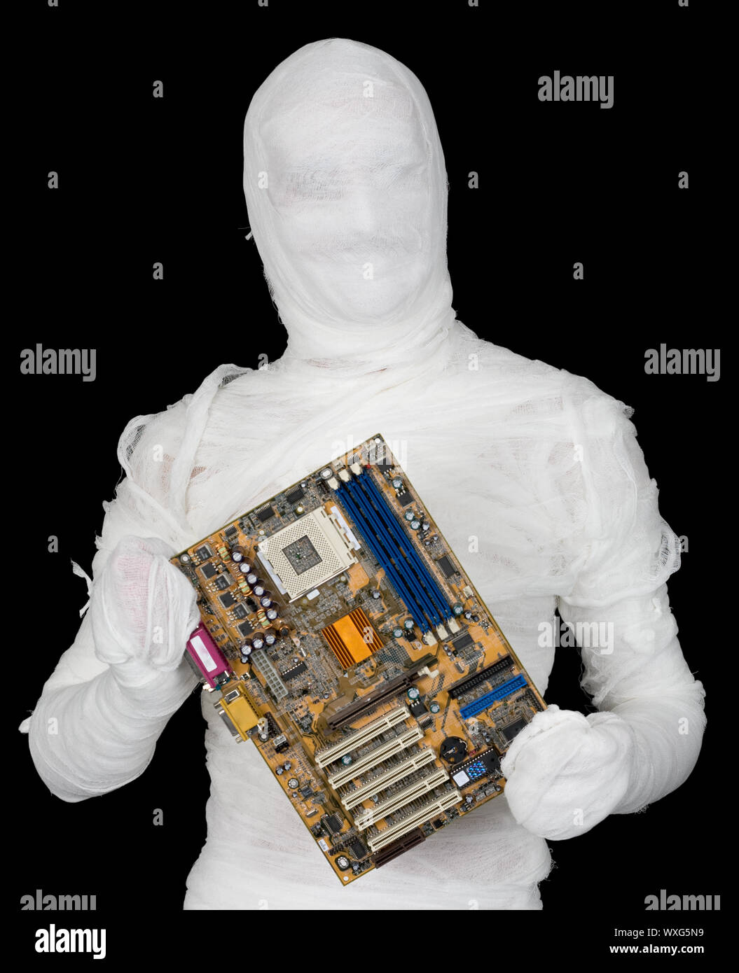 Bandaged man with motherboard on black background Stock Photo - Alamy