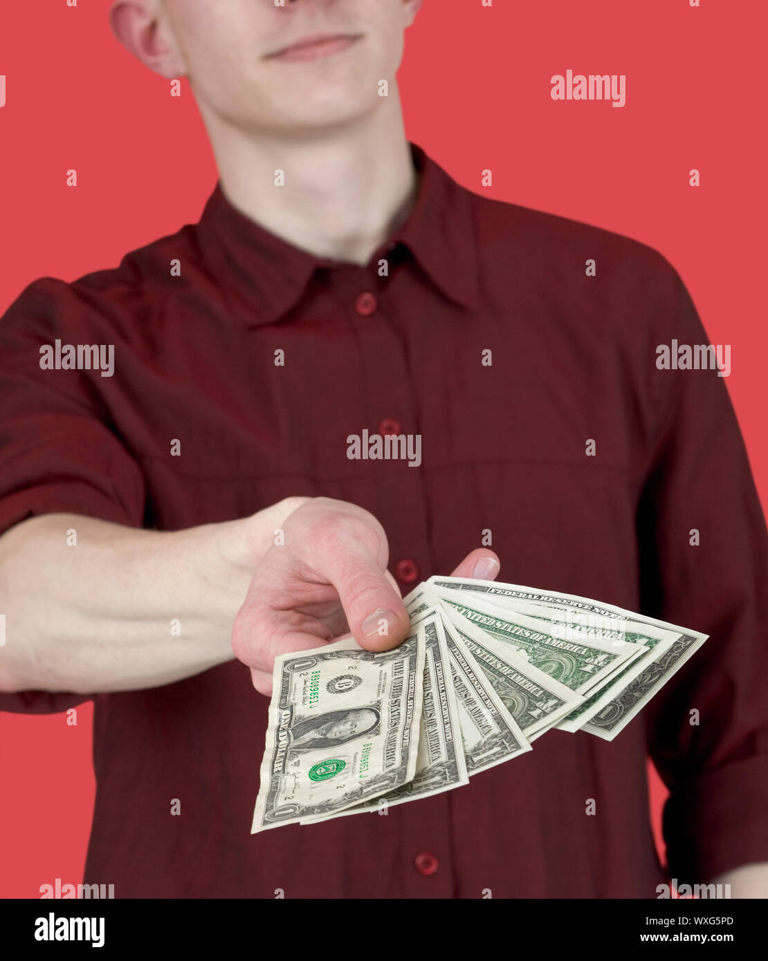 Man with pack of dollars on his hand Stock Photo - Alamy