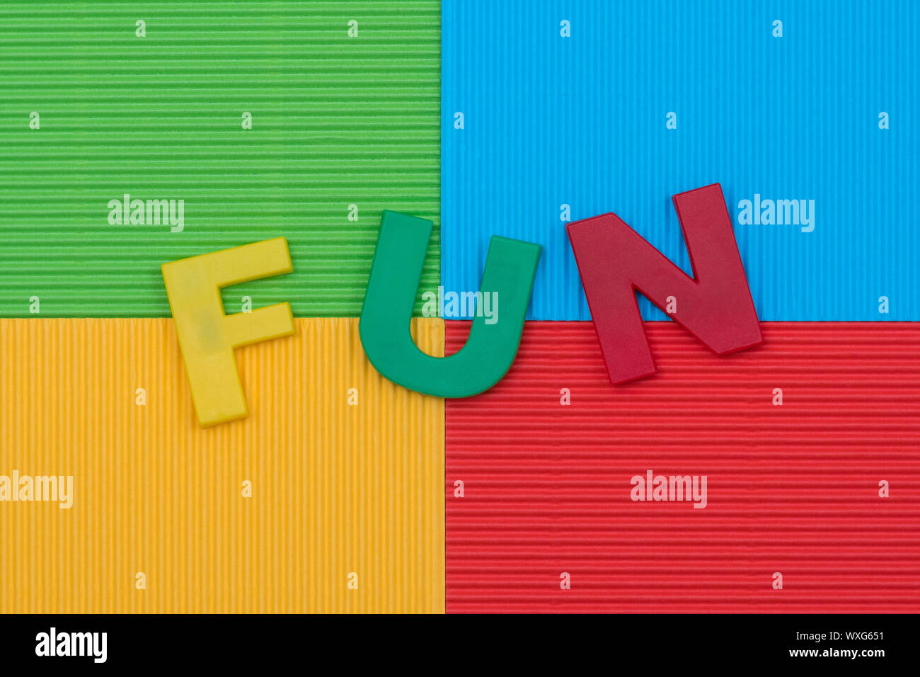 Word FUN with colourful letters on the color paper background Stock ...