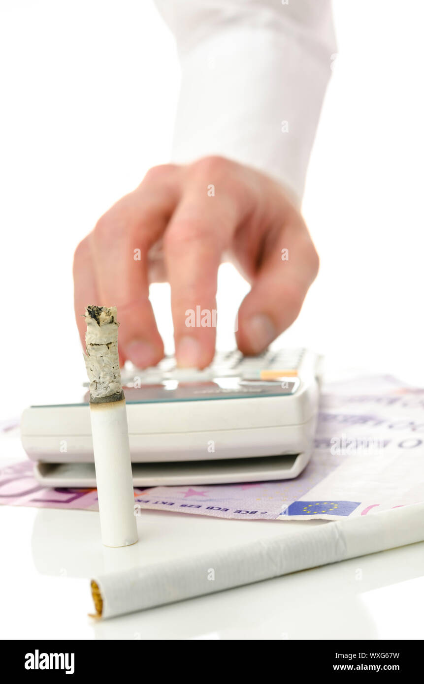 Money being burned away by smoking. Concept of unreasonable money ...