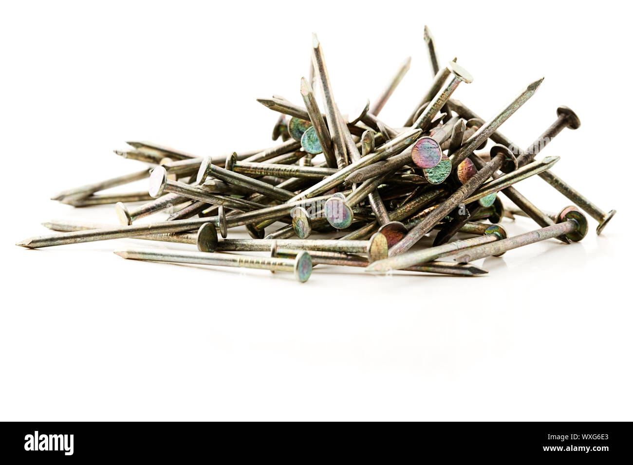 handfull of small nails on white background Stock Photo - Alamy