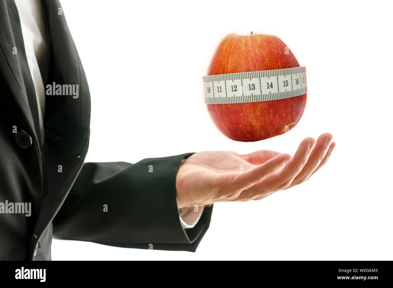 Male hand presenting apple wrapped with measuring tape Stock Photo - Alamy