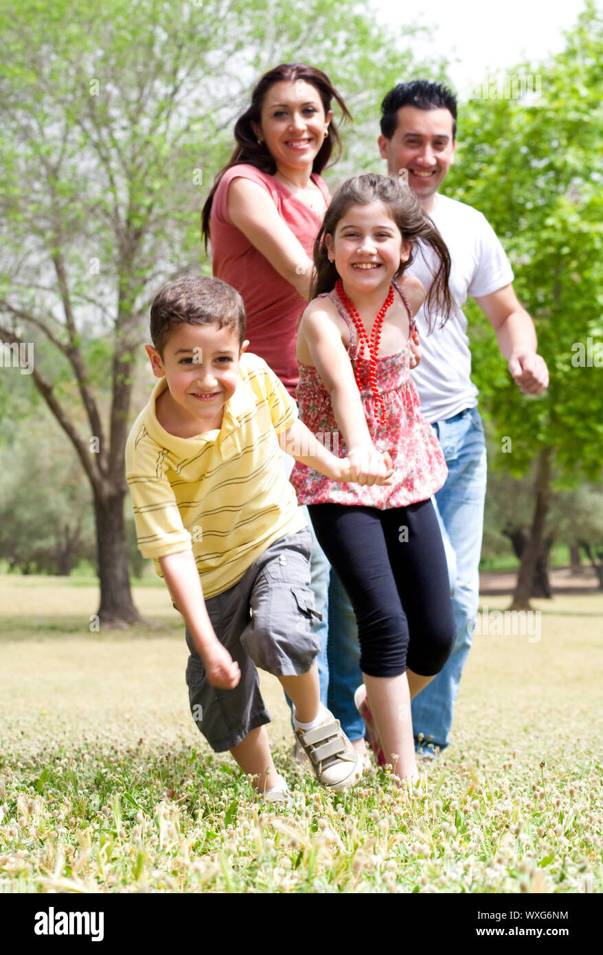 Happy family having fun in the park,outdoor Stock Photo - Alamy