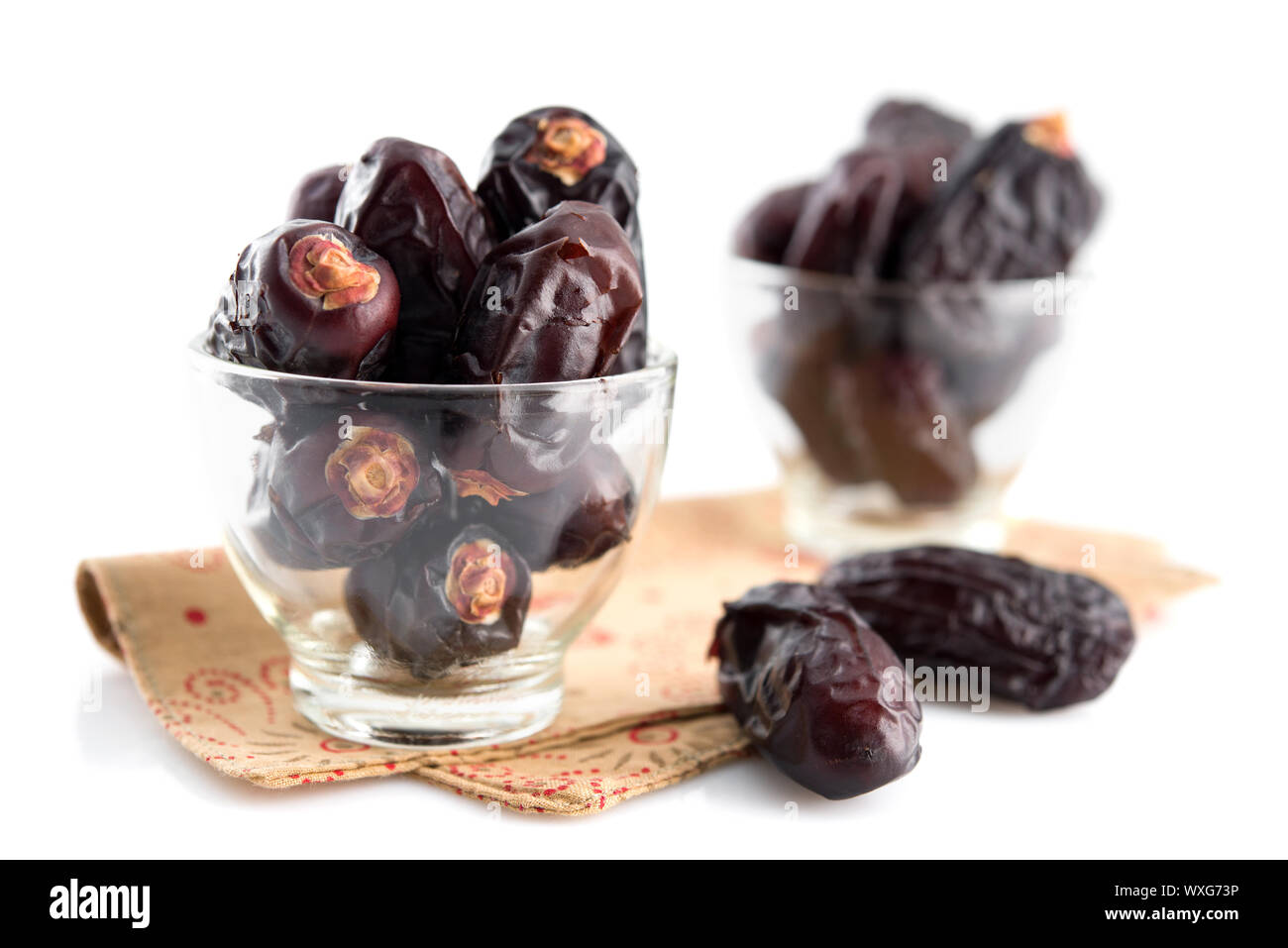 Dates fruit. Pile of fresh dried date fruits in glass isolated on white ...