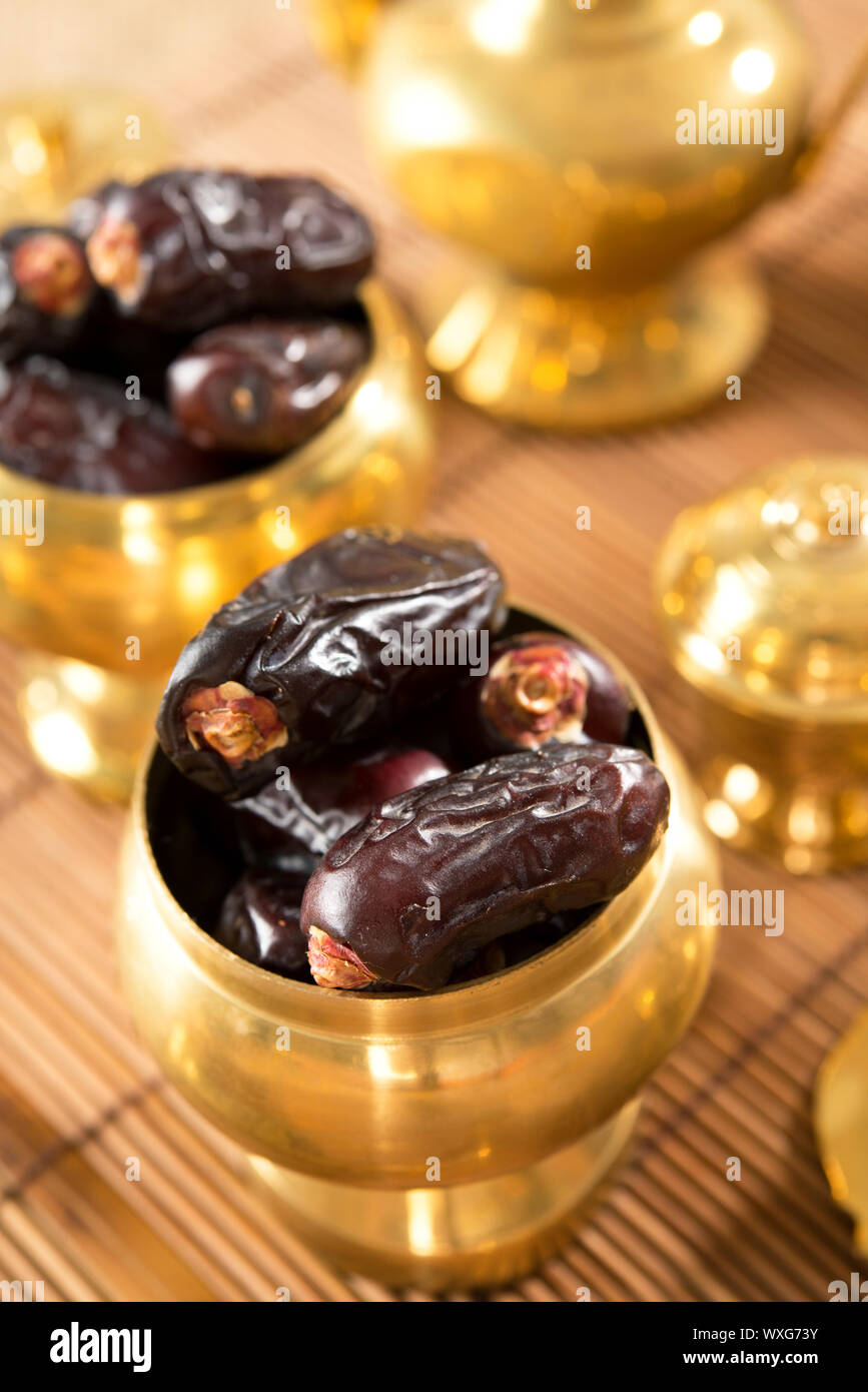 Dates in golden bowl arabic hi-res stock photography and images - Alamy