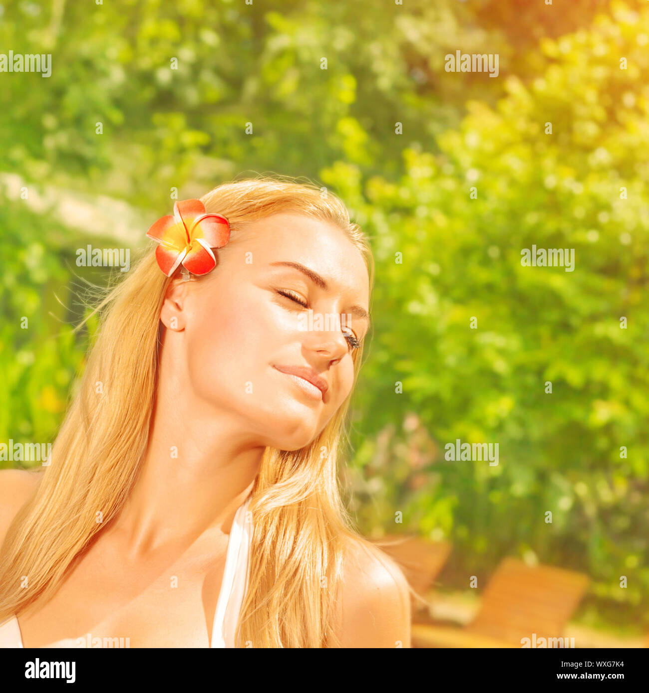 Closeup portrait of attractive female enjoying warm sunny day, closed ...