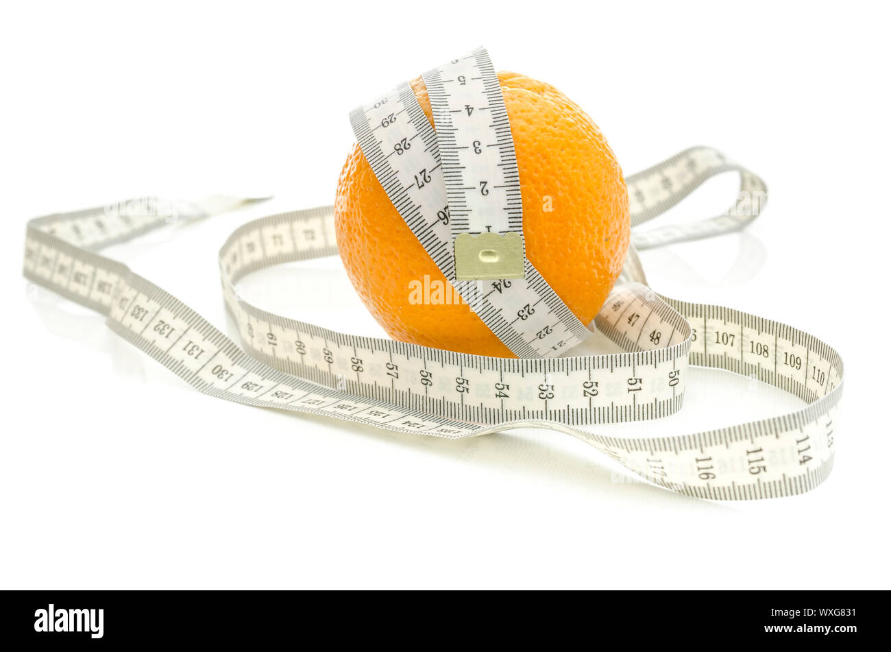 Measuring tape wrapped around orange fruit. Isolated over white ...