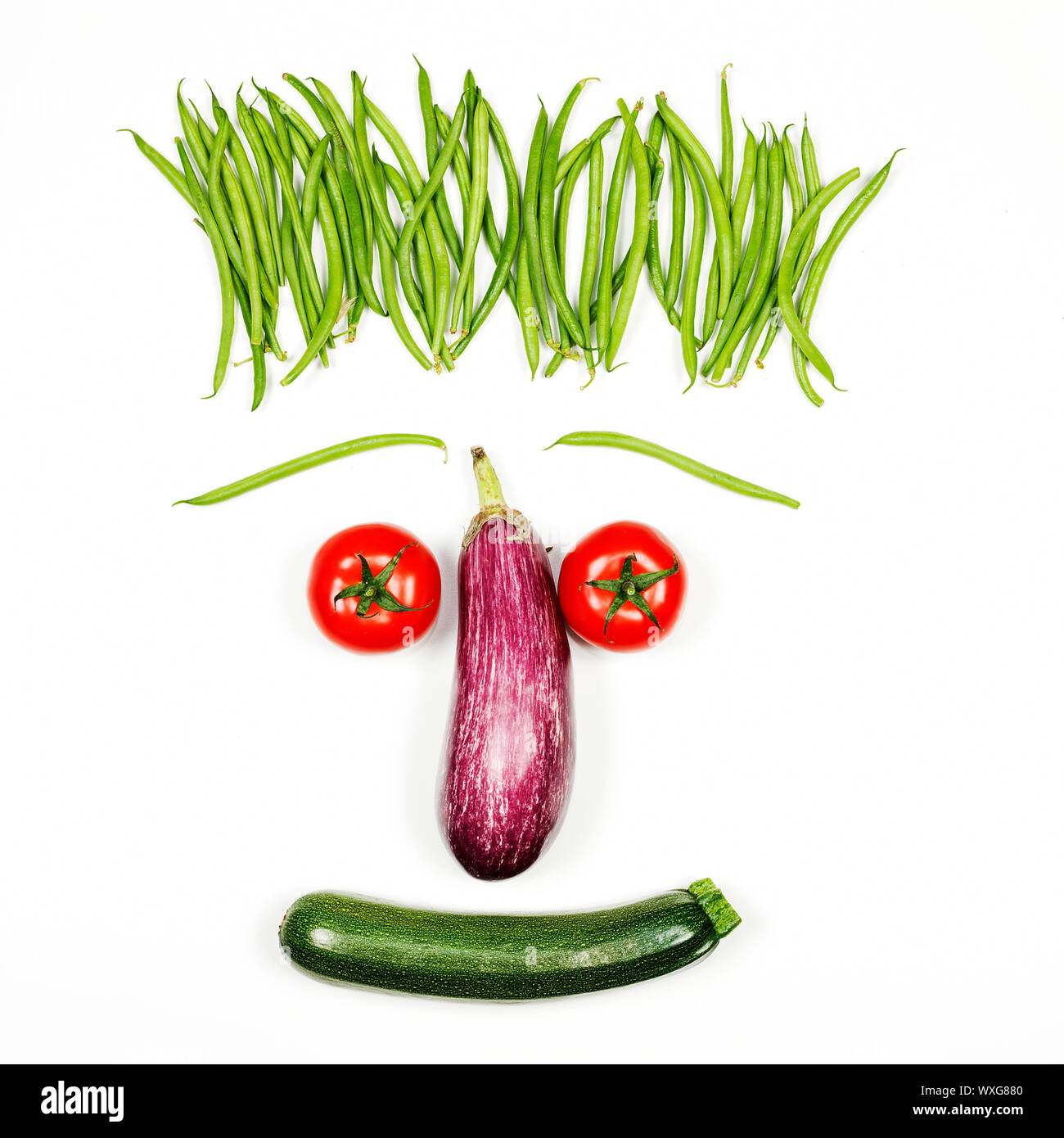 Funny vegetables face on white background Stock Photo - Alamy