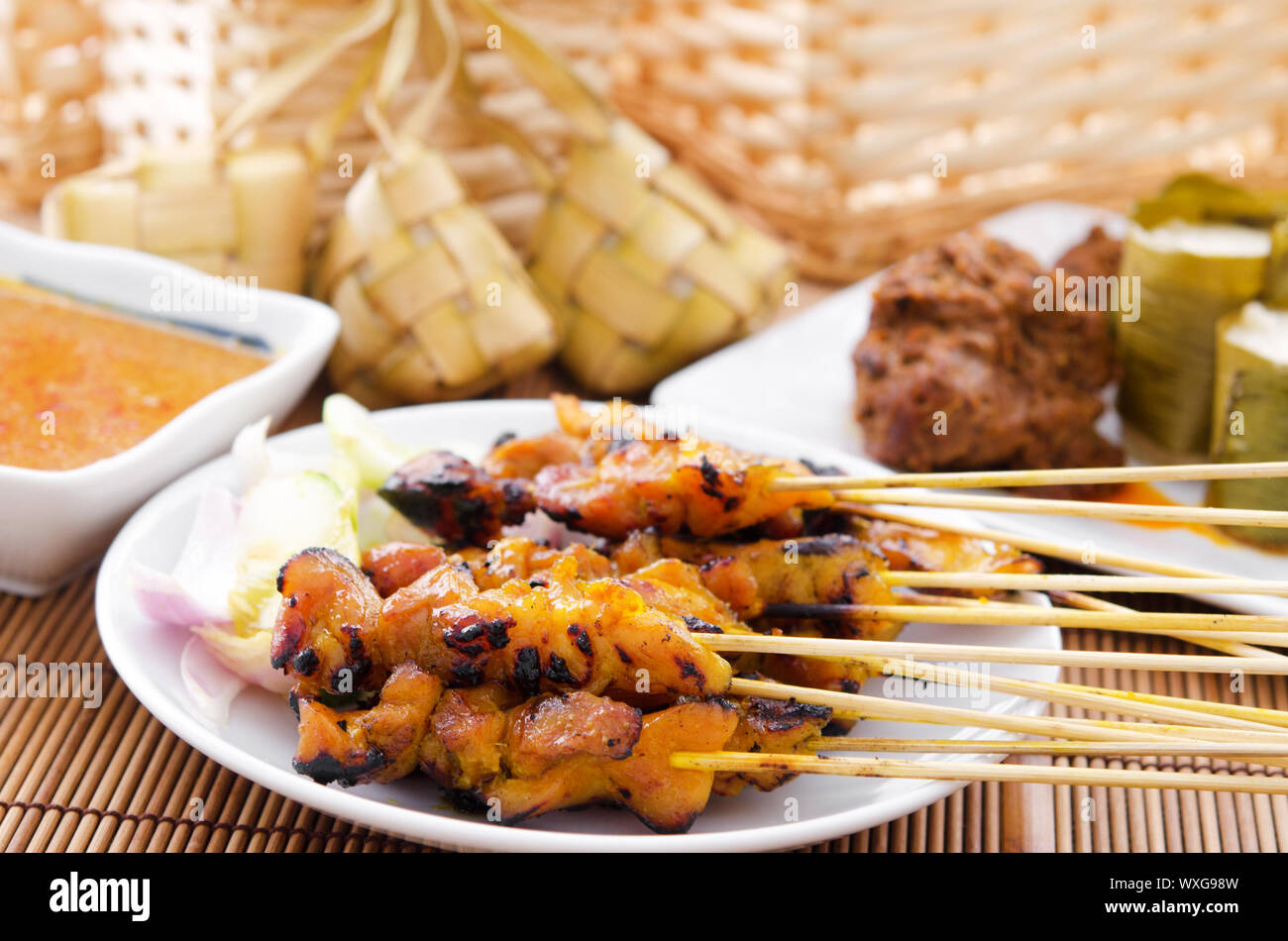 Chicken satay, ketupat or malay rice dumpling, lemang, rendang ...