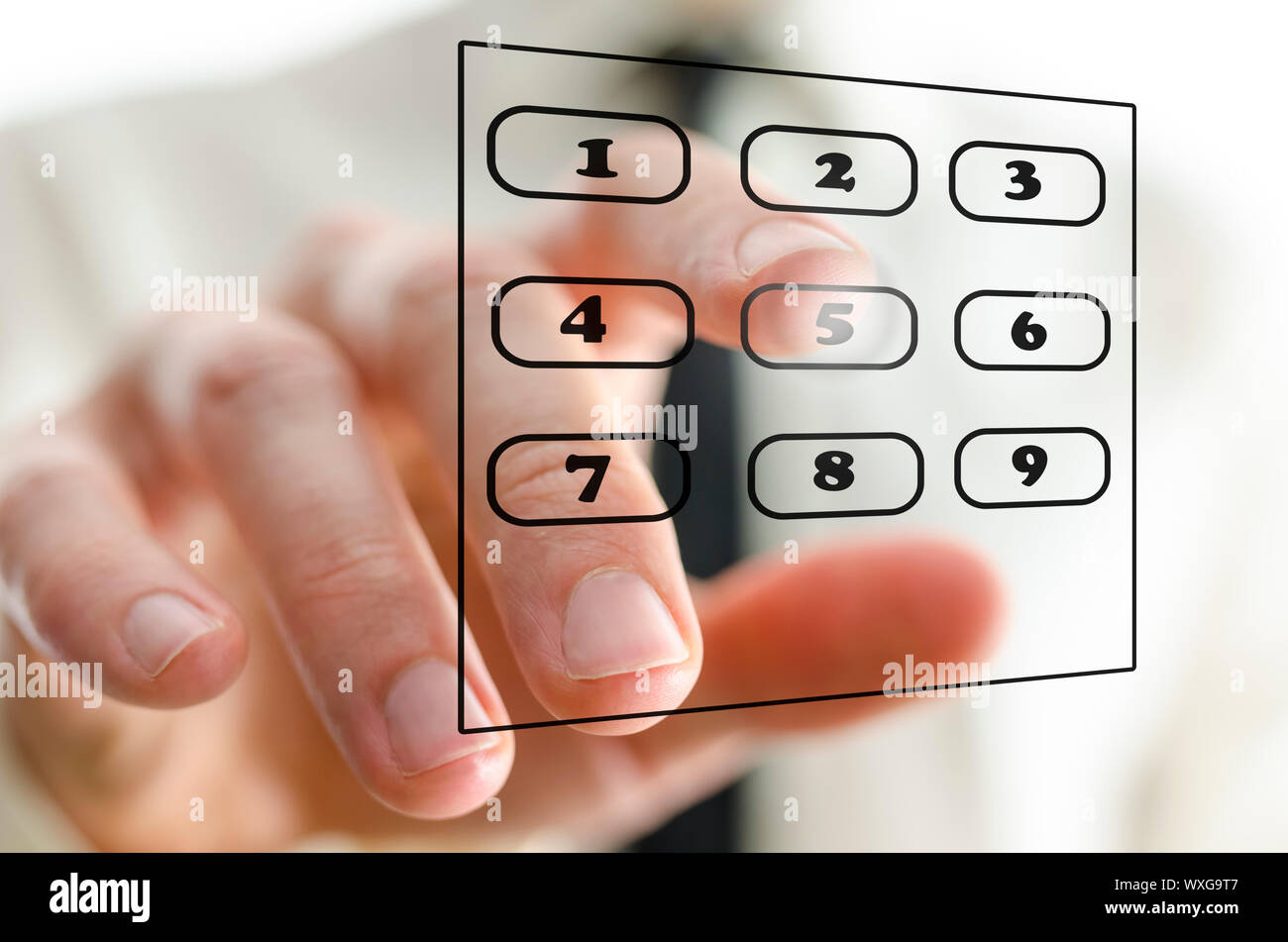 Business man navigating virtual telephone keypad Stock Photo - Alamy