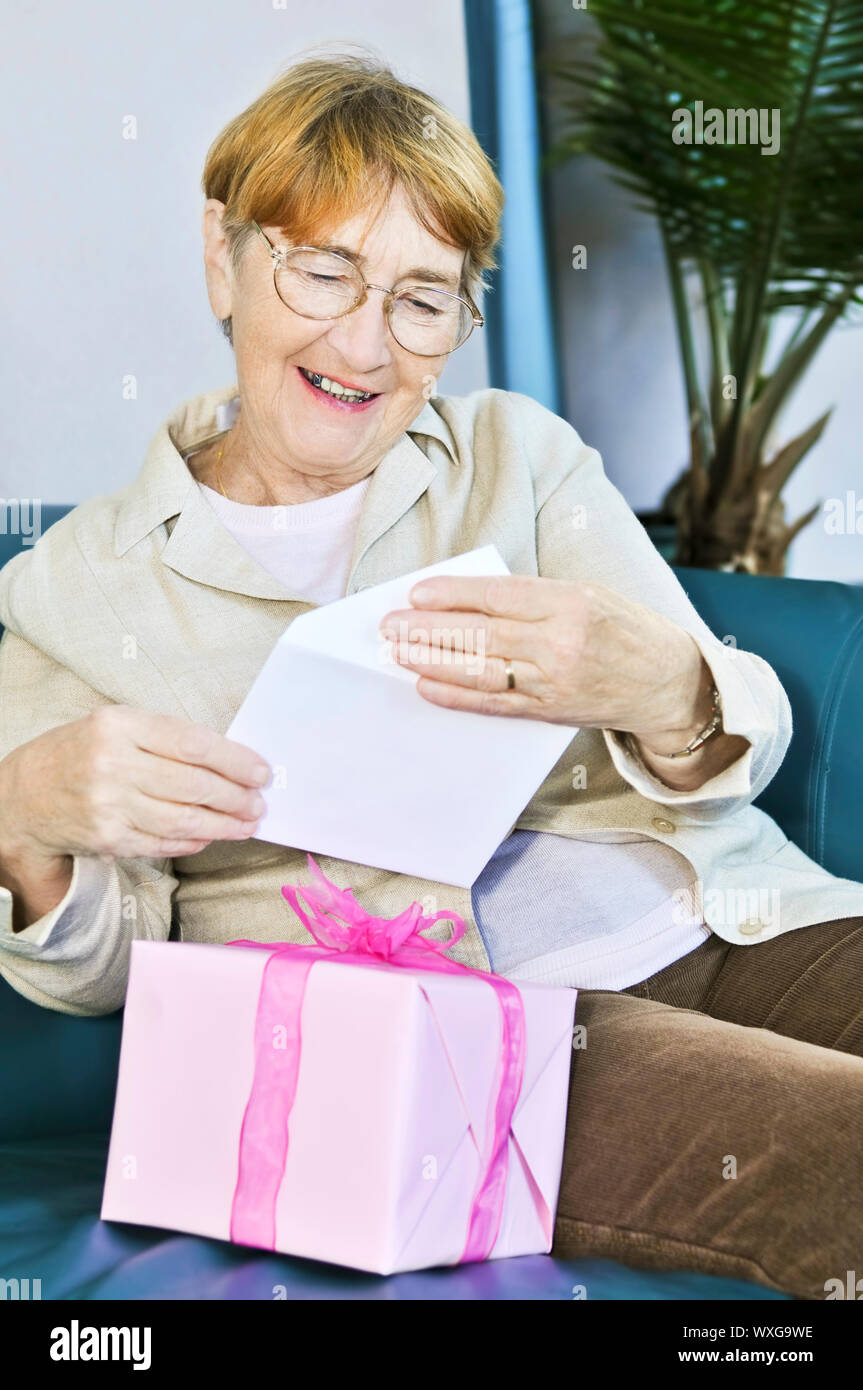 Woman opening birthday card hi-res stock photography and images - Alamy
