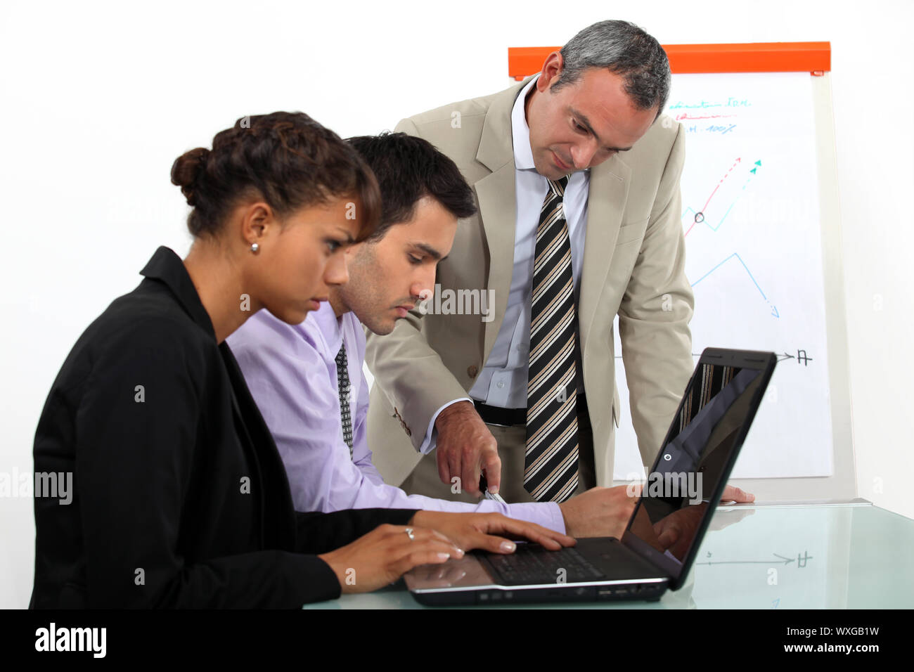Sales team working at laptops Stock Photo - Alamy