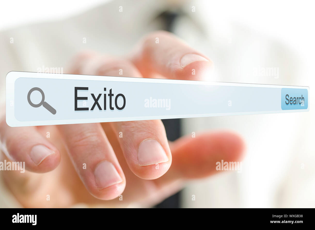 Word Exito written in search bar on virtual screen. Spanish for success ...