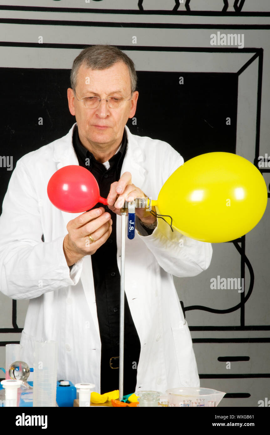 serious professor with balloon experiment in the laboratory Stock Photo ...