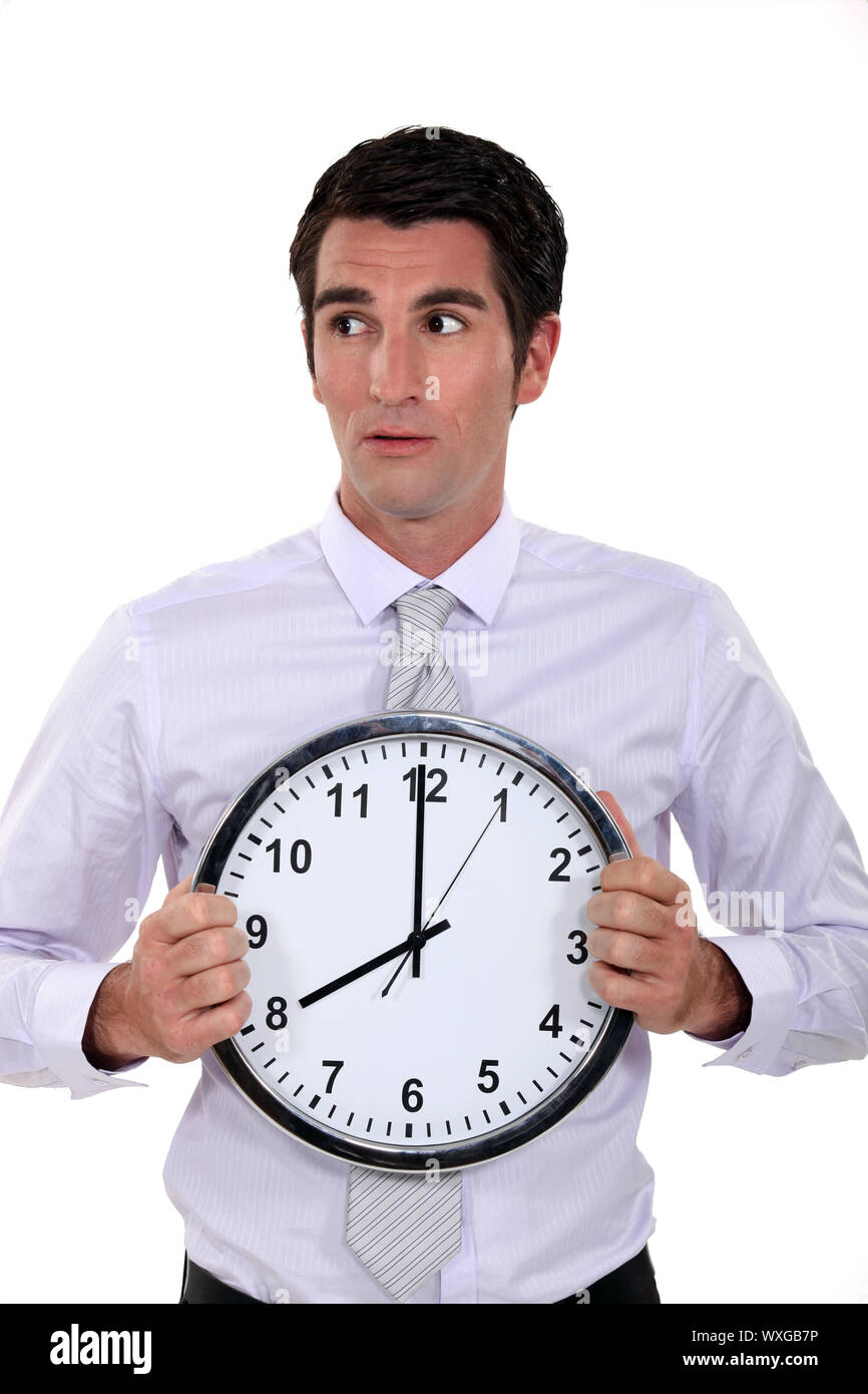 Man holding large clock hi-res stock photography and images - Alamy