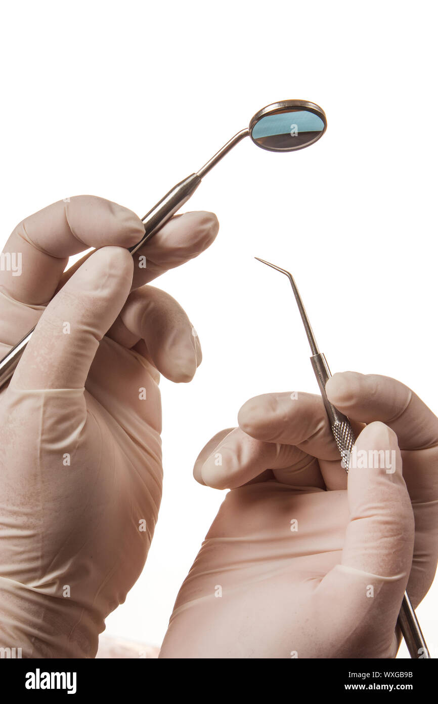 Dental tools isolated on white background Stock Photo - Alamy