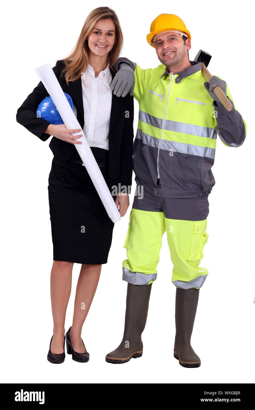 Female architect stood with manual worker Stock Photo - Alamy