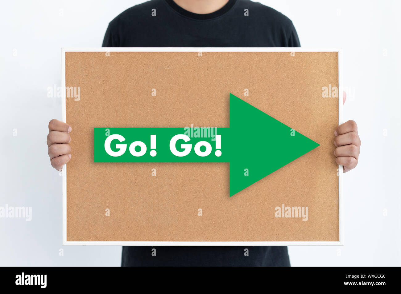Go! Go! man written text on broad arrow pointing to gold sign copy ...
