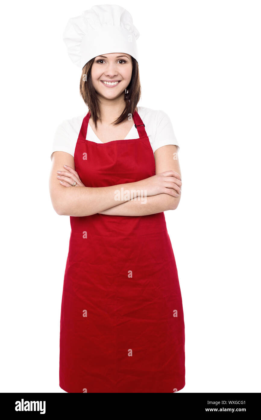 Confident young female chef with folded arms Stock Photo - Alamy
