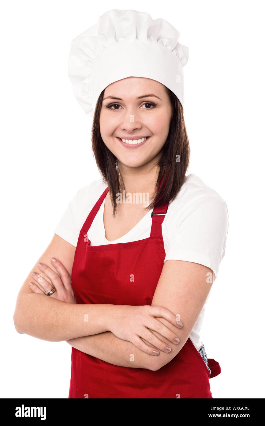 Pretty baker woman posing with confidence, arms folded Stock Photo - Alamy