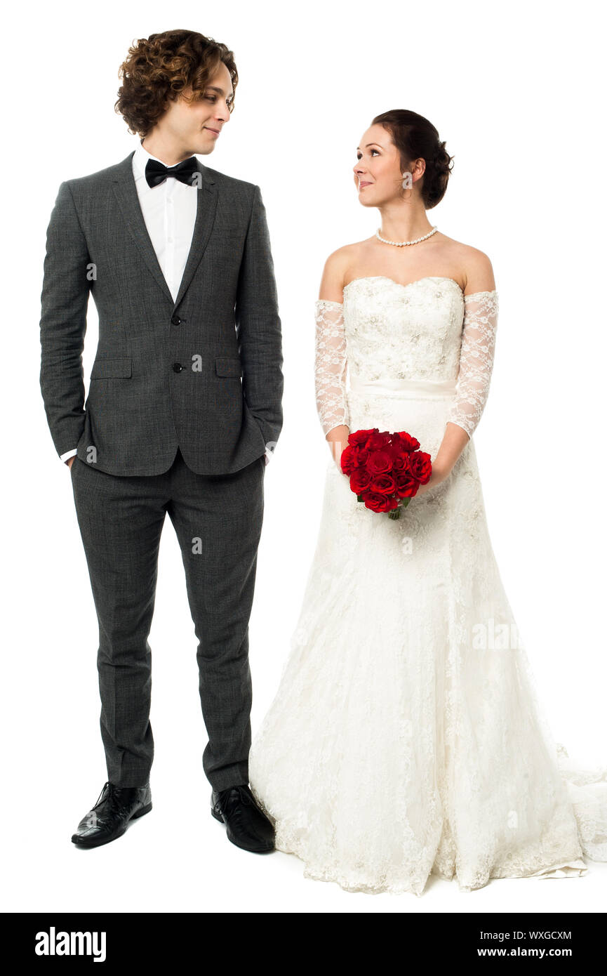 Bridal couple lost in each other over white Stock Photo - Alamy