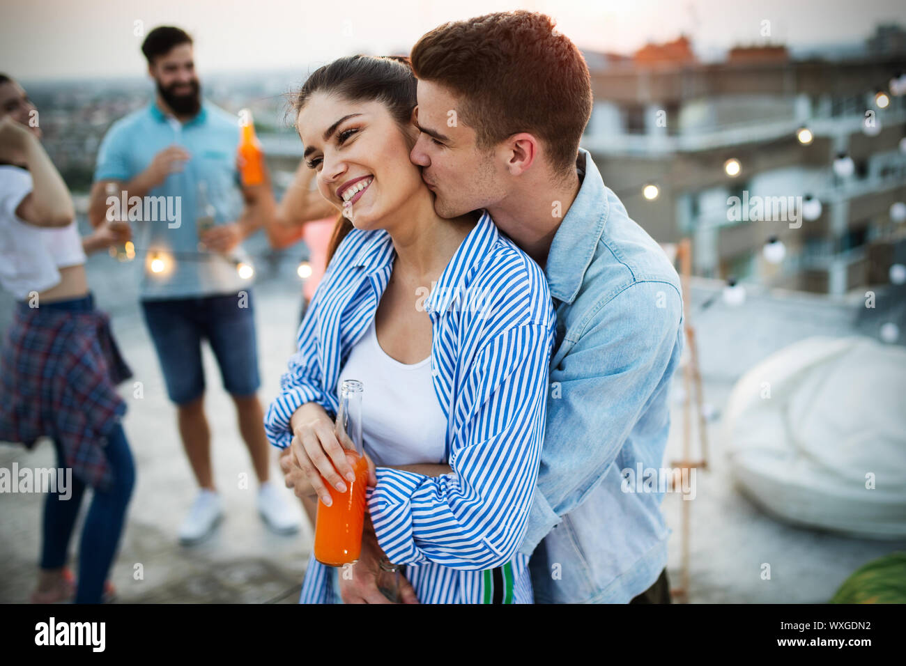 Happy lovely couple having fun time at party Stock Photo - Alamy