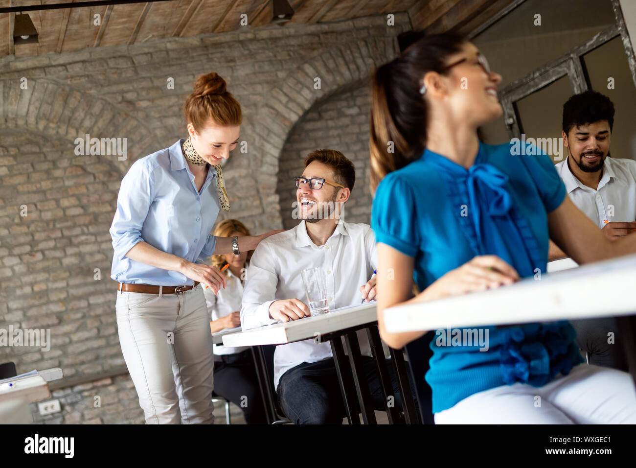 Successful happy group of people learning software engineering and ...