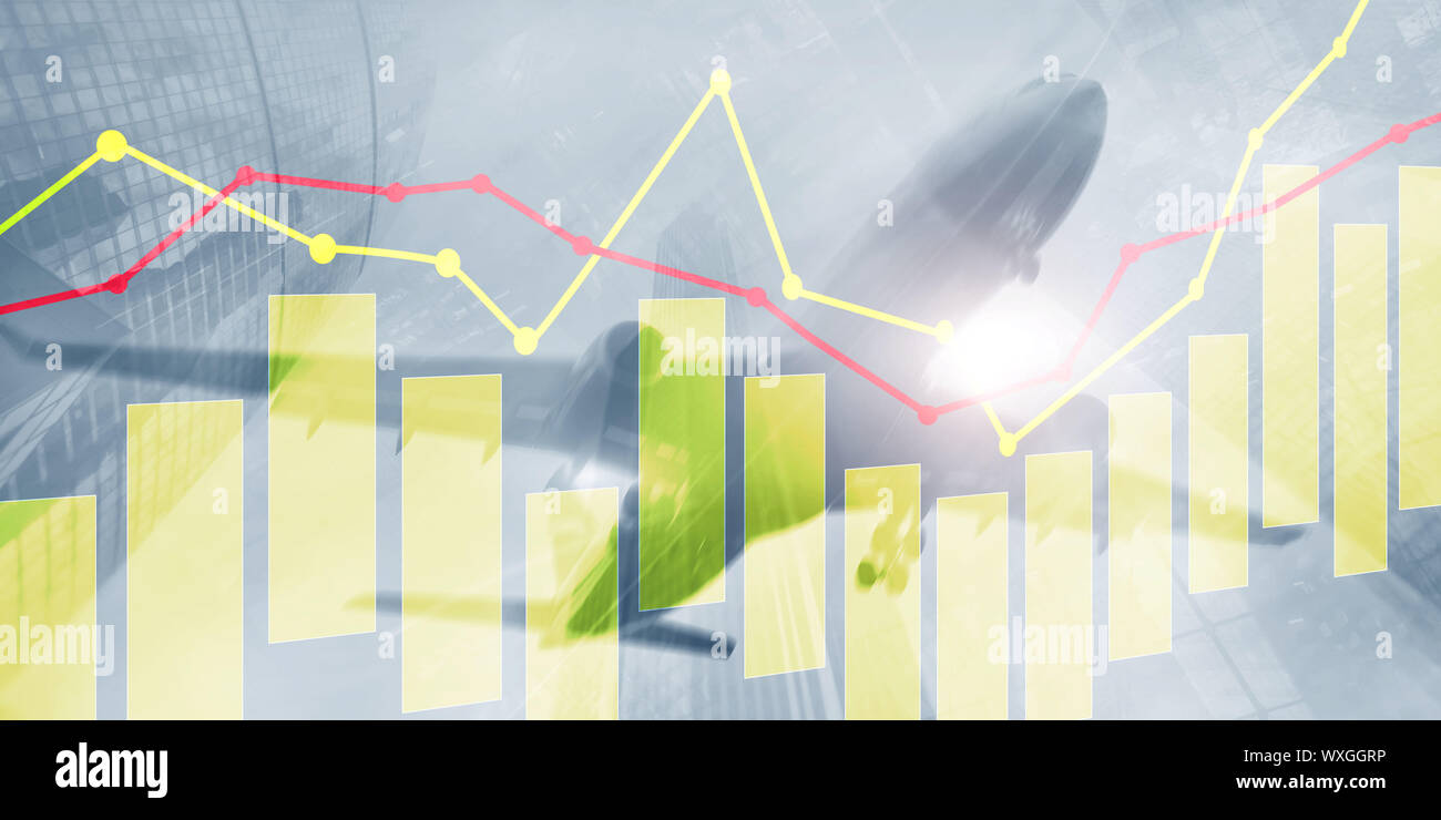 Yellow and red candles and charts on business technology background ...
