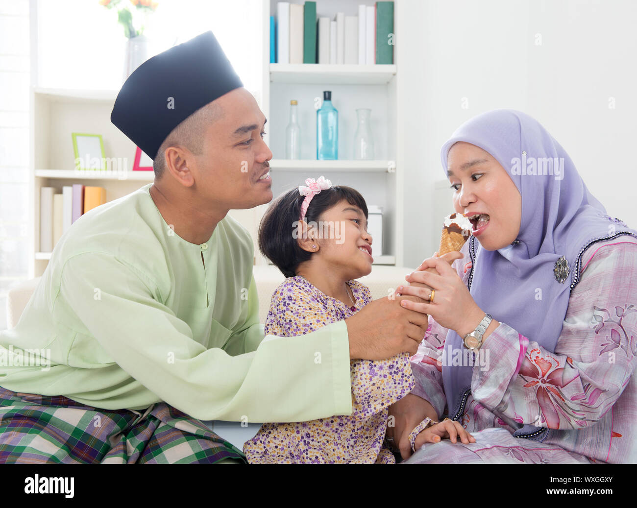 Muslim girl eating ice cream hi-res stock photography and images - Alamy