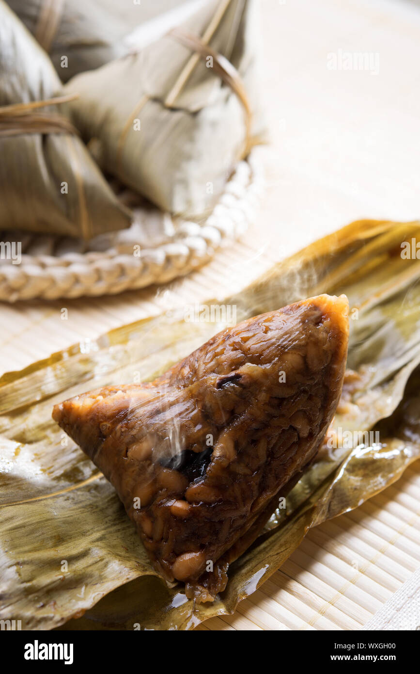 Hot steamed rice dumpling or zongzi. Traditional steamed sticky ...