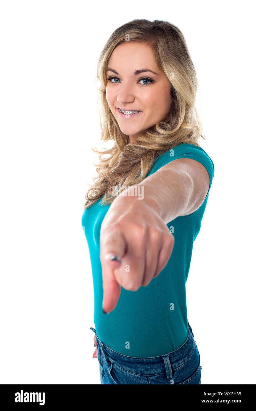 Attractive female pointing towards you Stock Photo - Alamy