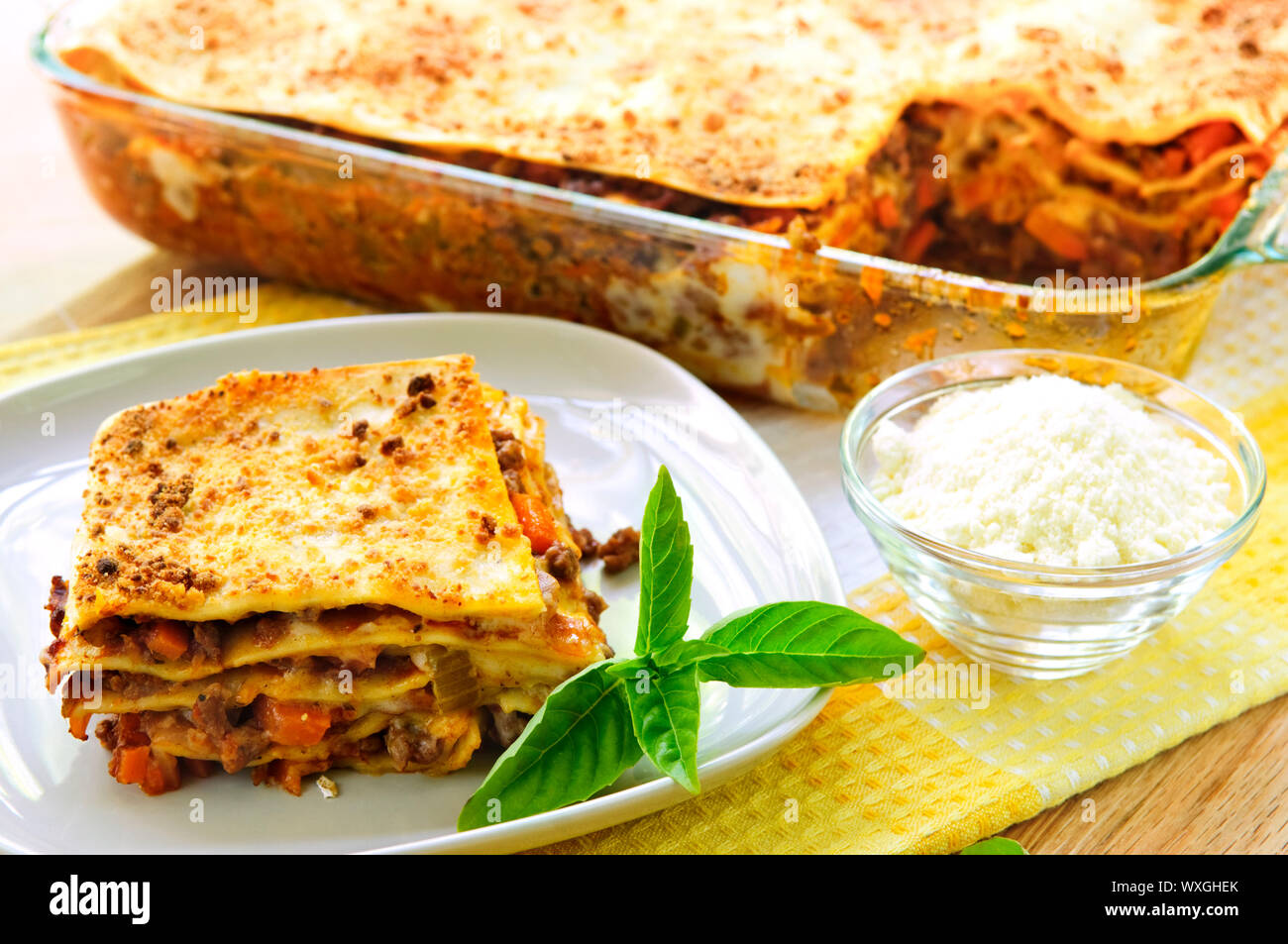 Fresh baked lasagna casserole with a serving cut Stock Photo - Alamy