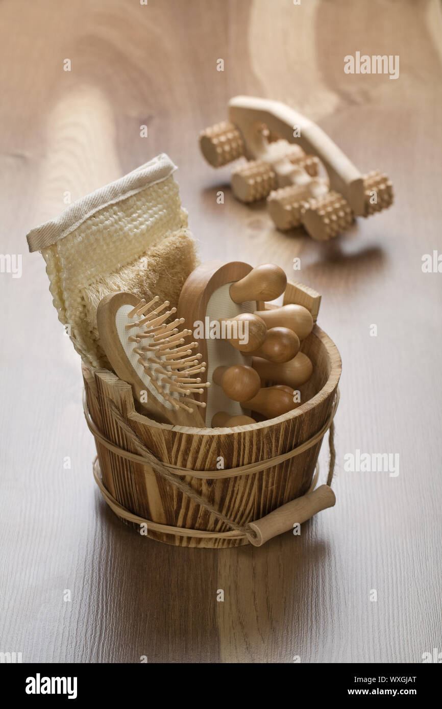wooden bucket and massager Stock Photo - Alamy