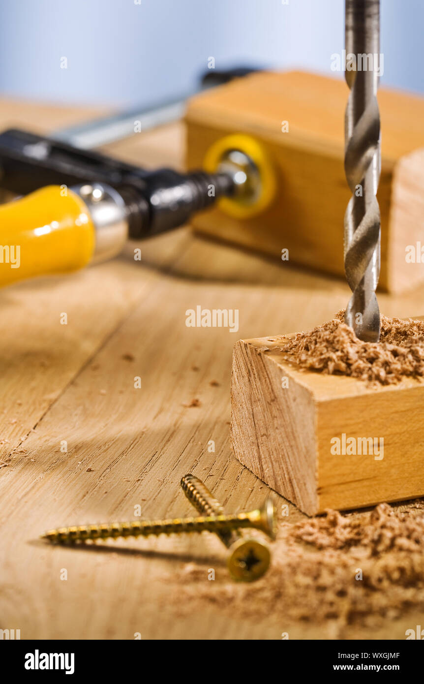 Drilling hole in a wooden plank Stock Photo - Alamy