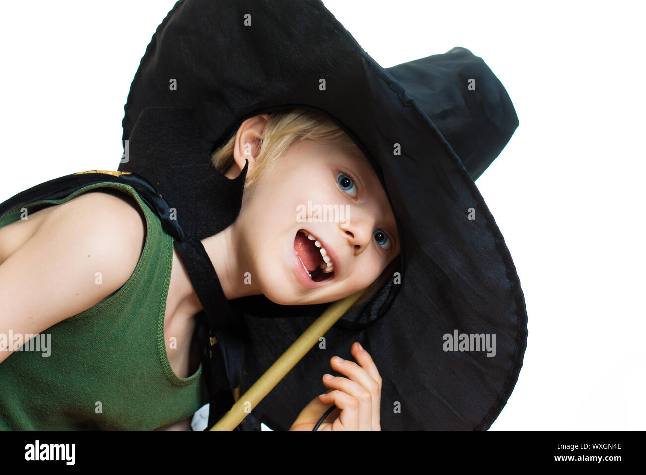 A cute boy dressed up as a witch. Isolated on white Stock Photo - Alamy