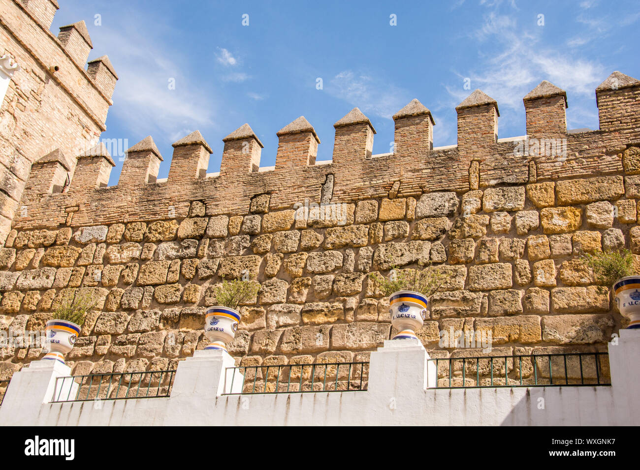 The walls of a castle in the city of Seville, Spain Stock Photo - Alamy
