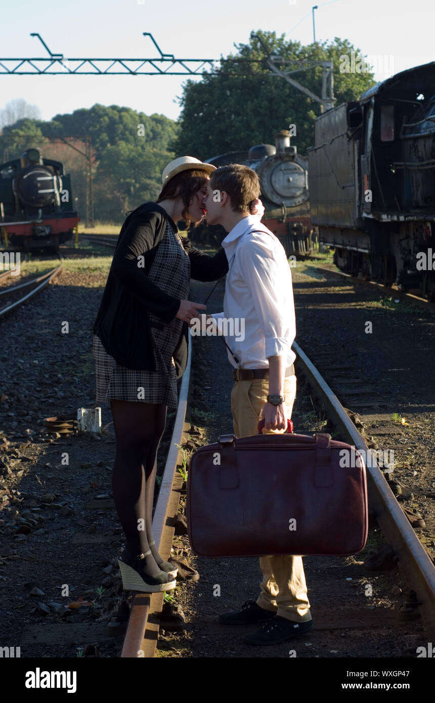 Couple kissing train station hi-res stock photography and images - Alamy