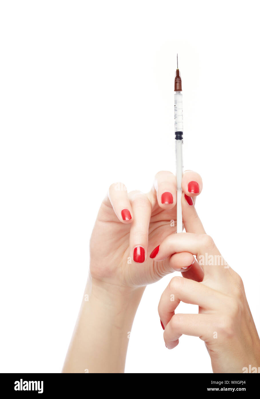 Female hands holding the medical syringe Stock Photo - Alamy