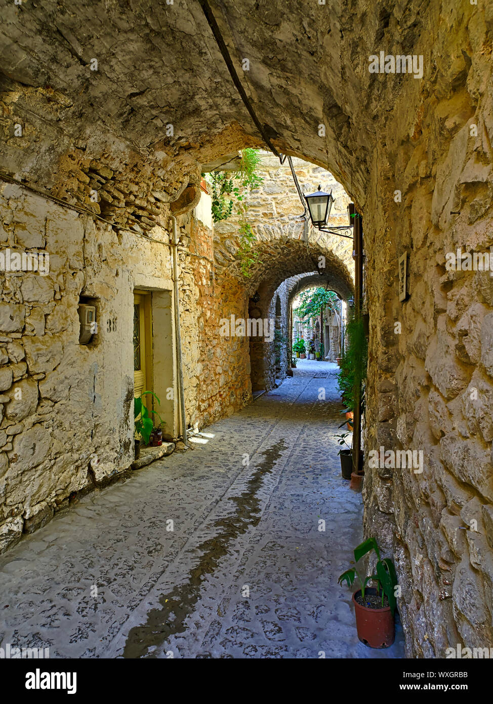 Narrow alley at the medieval castle village of Mesta in Chios island ...